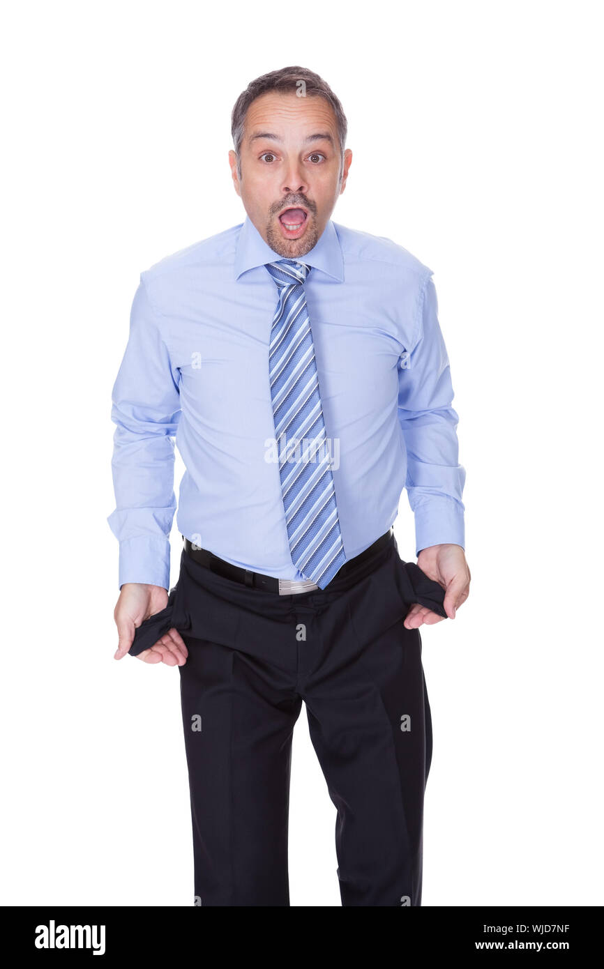 Businessman Showing Empty Pockets On White Backgrounds Stock Photo - Alamy