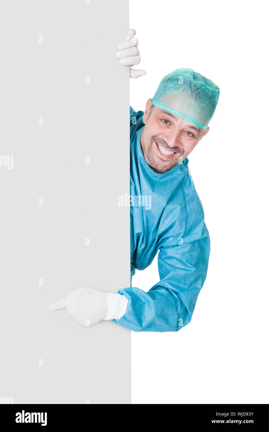 Doctor In Operation Gown Holding Blank Placard On White Background ...