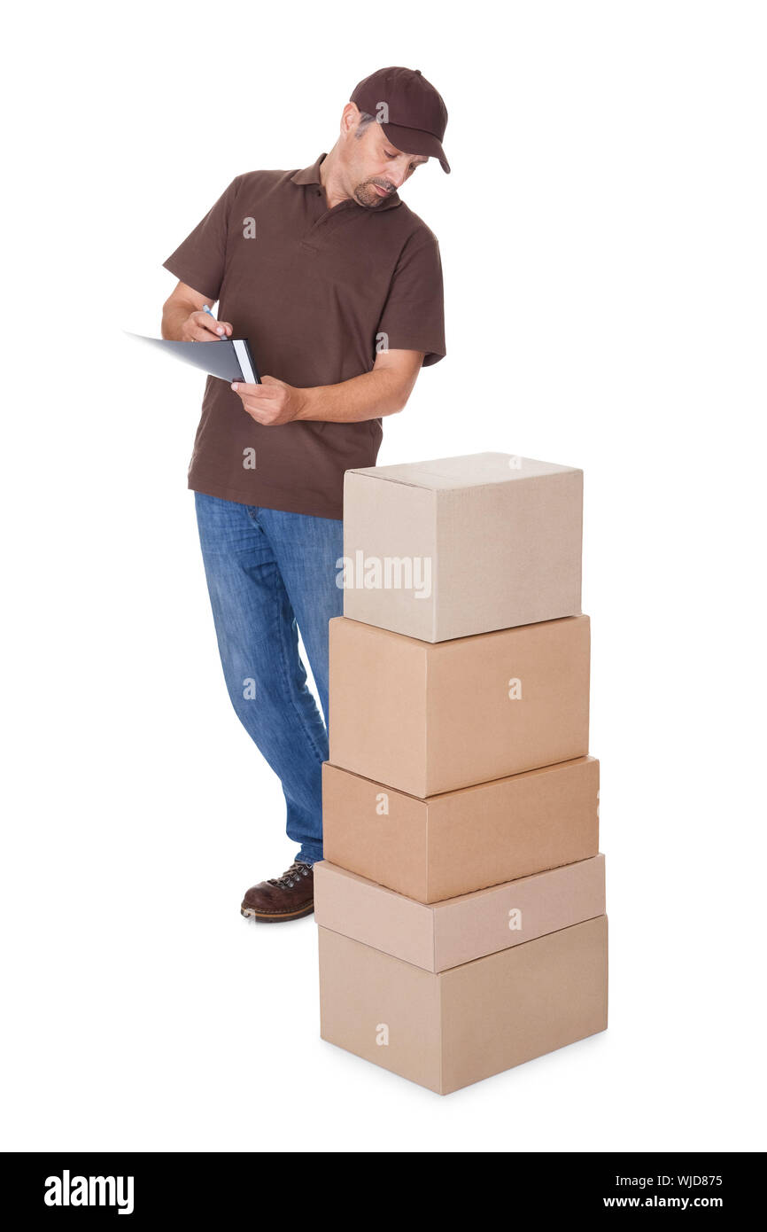 Delivery Man Counting Boxes Isolated On White Background Stock Photo ...
