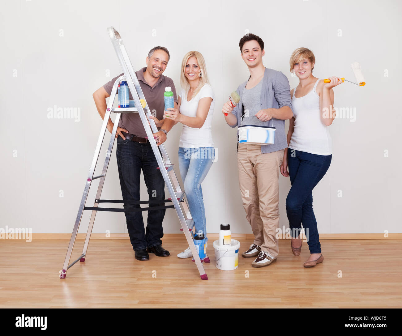Home maintenance repair team with all four members of the family lined ...
