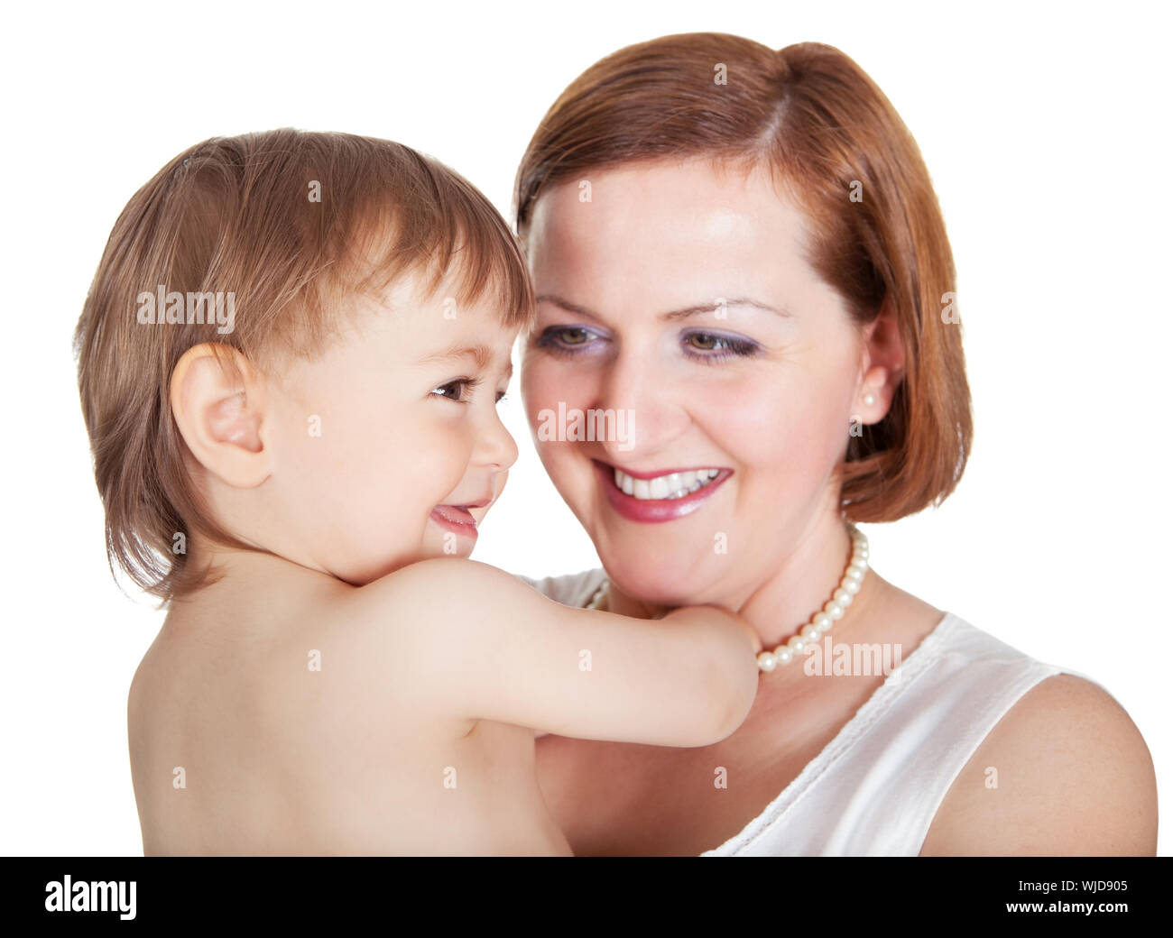 Tender moment between Mum and her baby little daughter as they smile ...