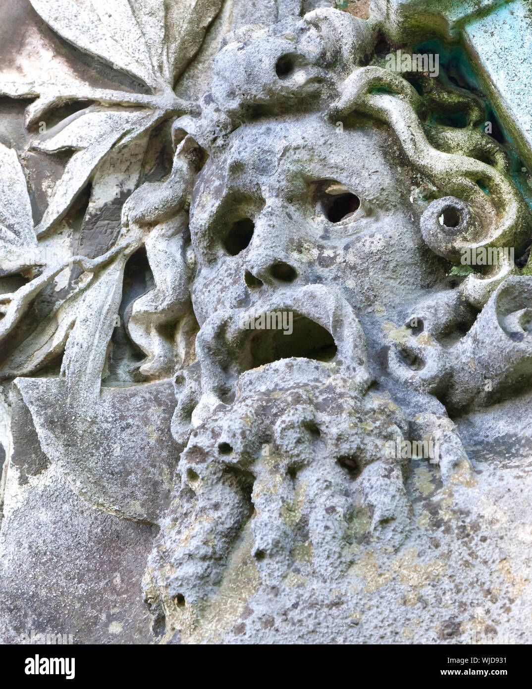 An image of an old grunge stone face Stock Photo - Alamy