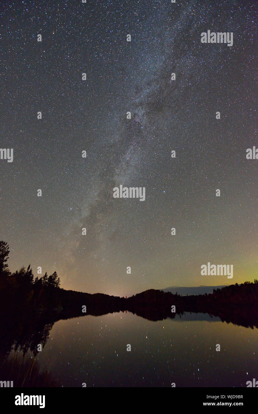 The Milky Way, with a faint Aurora (northern lights) reflected in St ...