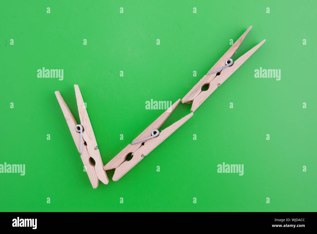 Acceptance sign made of wooden clothes pegs on a green background Stock ...