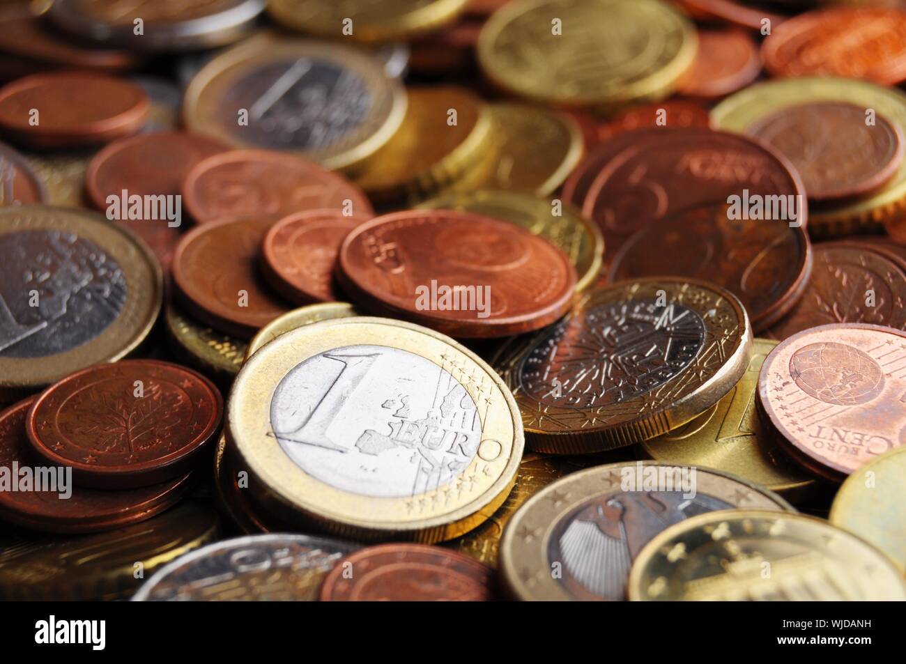 pile of euro money coins showing financial success Stock Photo - Alamy