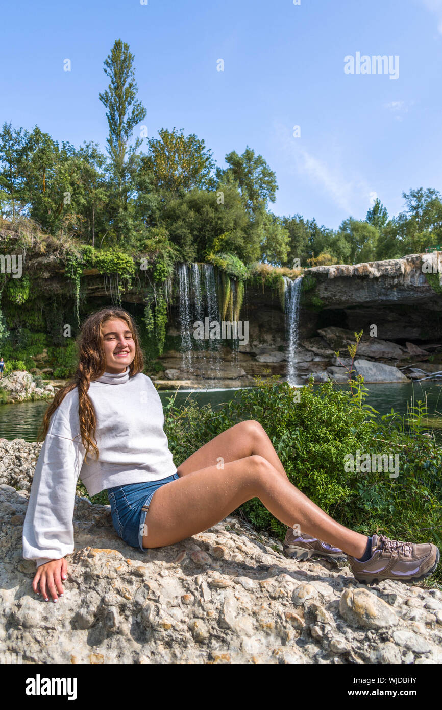 Girl and waterfall hi-res stock photography and images - Alamy