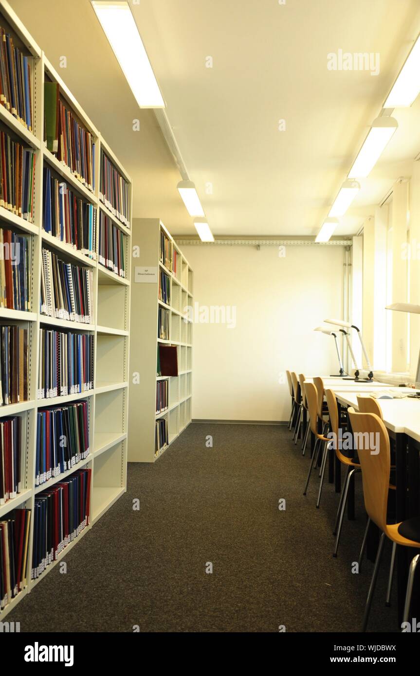 book in a library book shelf showing study concept Stock Photo - Alamy