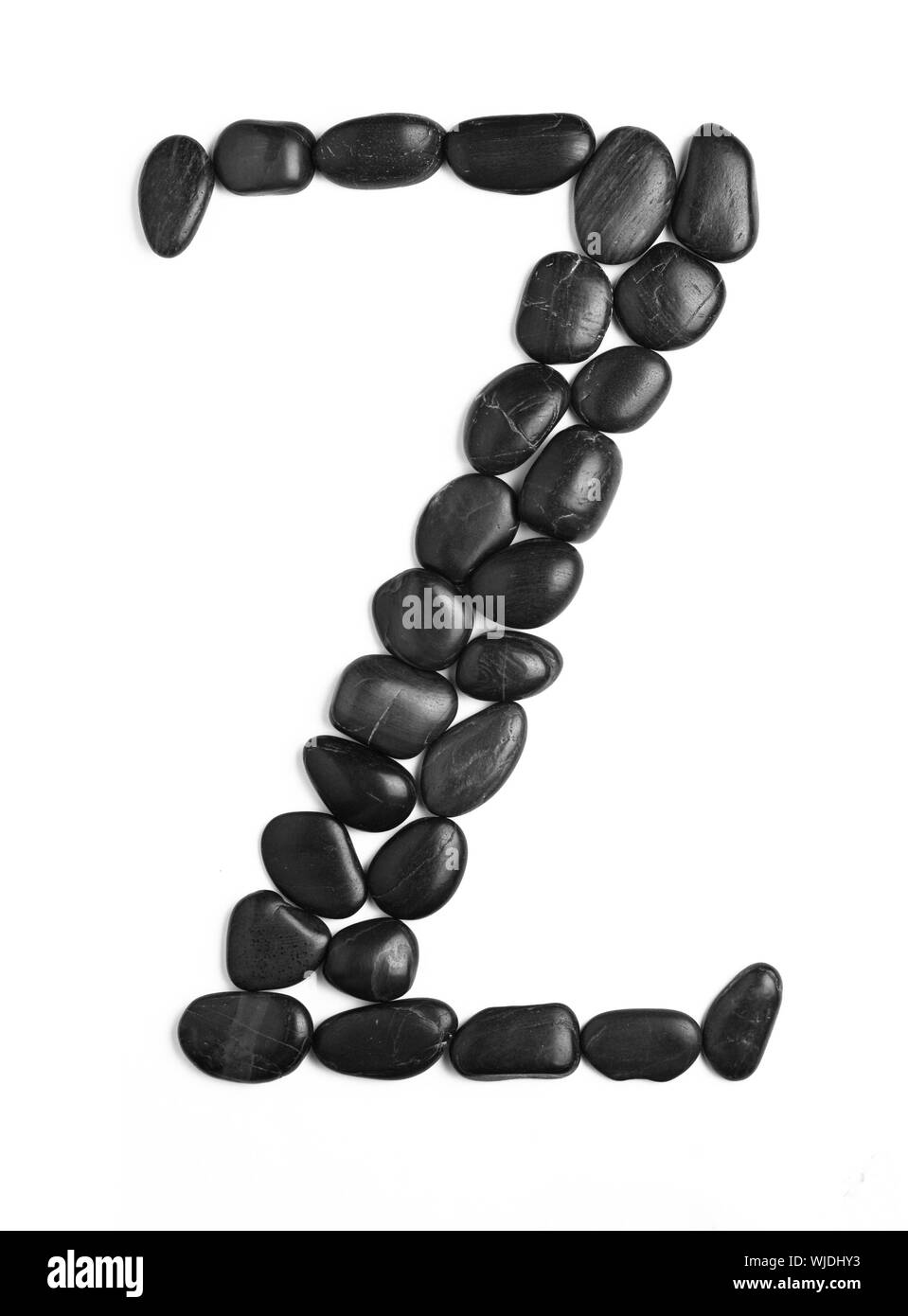 Black rock letter photographed against a white background Stock Photo ...