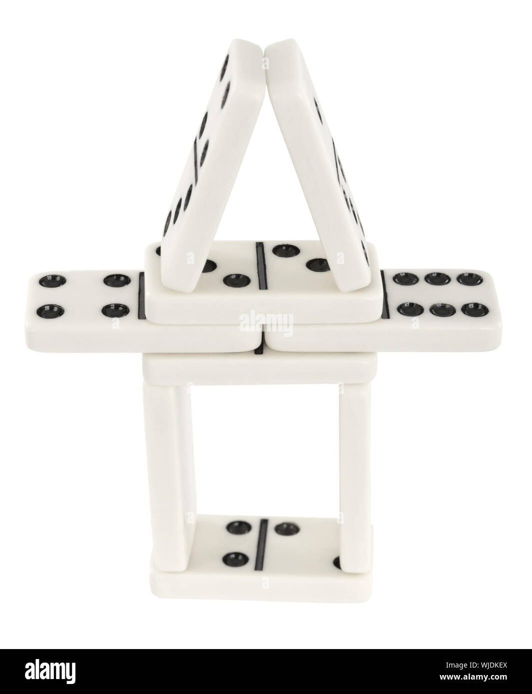 Small tower made of dominoes bones isolated on white Stock Photo - Alamy