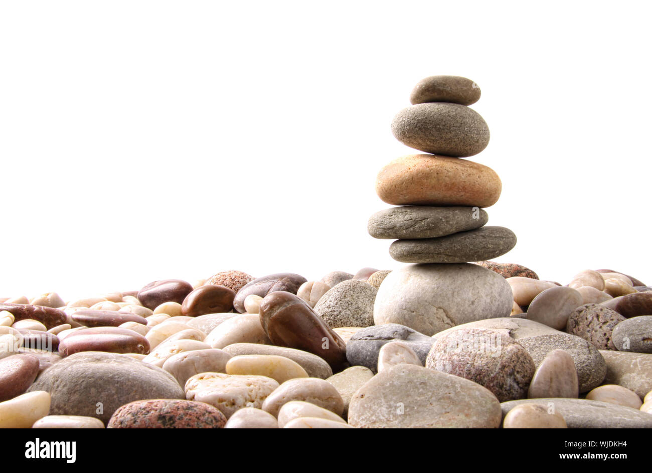 Stack of pebble stones on white background Stock Photo - Alamy