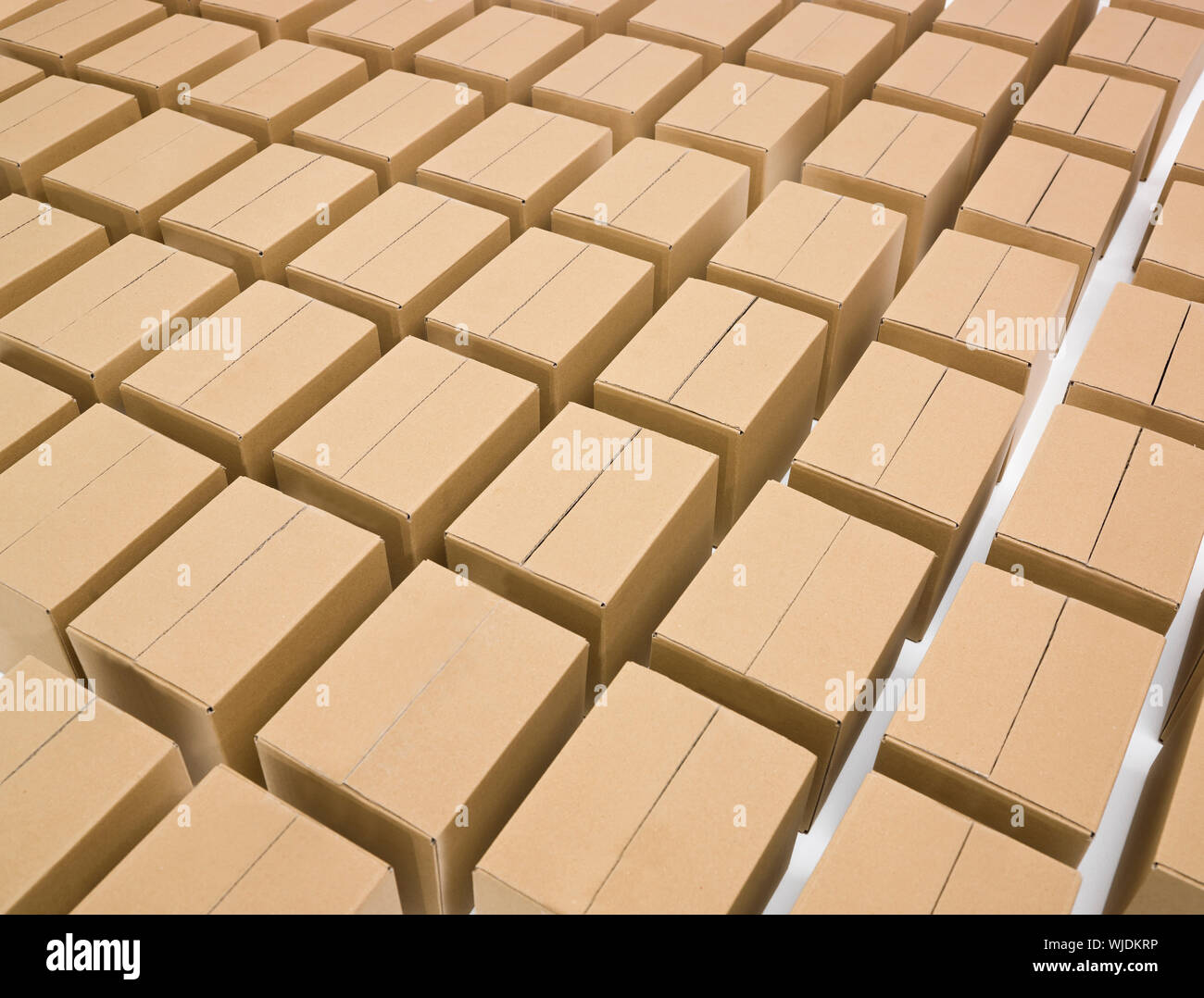 Arranged cardboard boxes on white background Stock Photo - Alamy