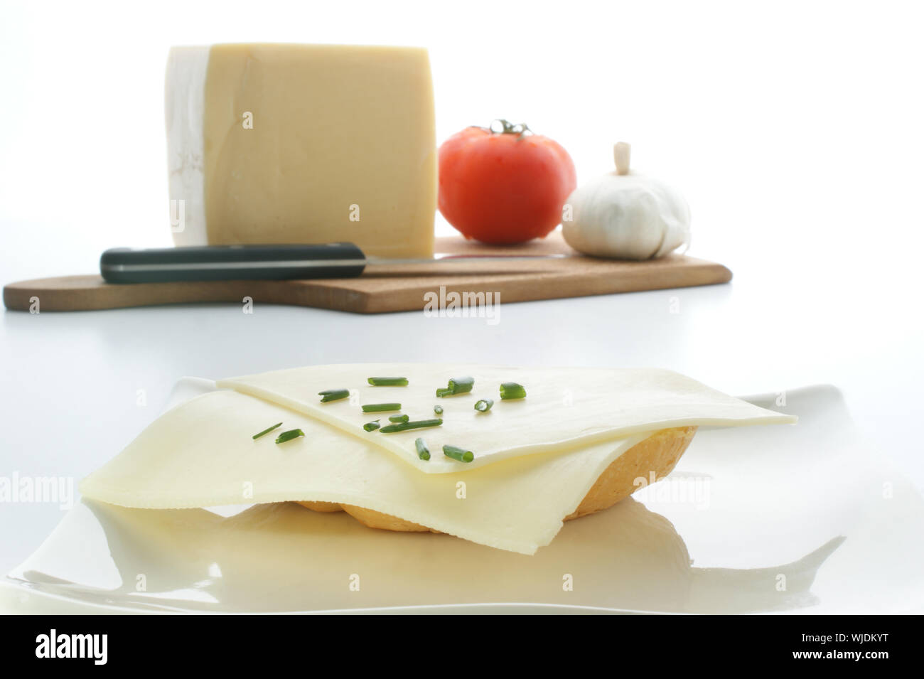 half roll for breakfast on a white plate Stock Photo - Alamy