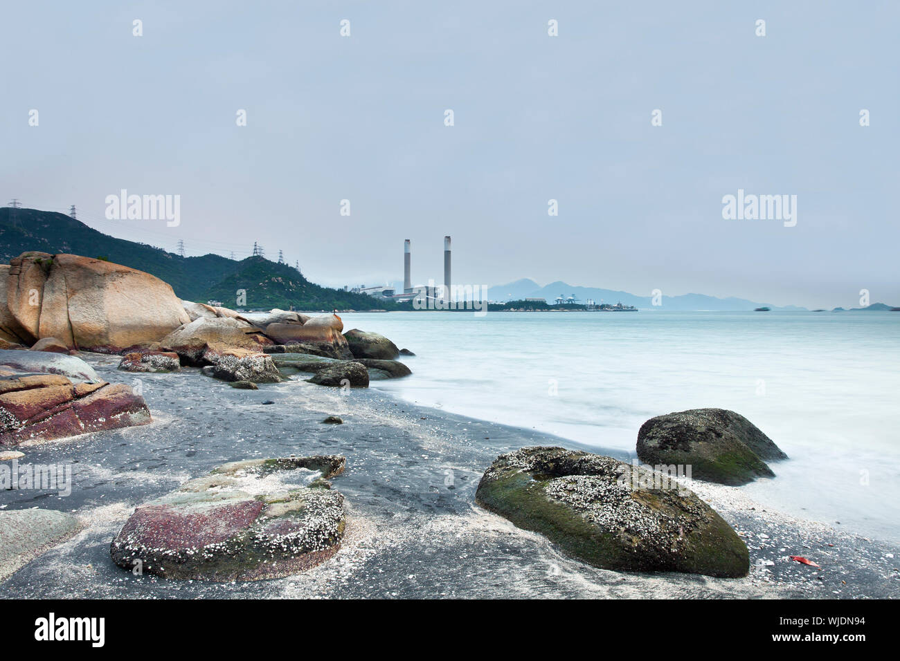 Power plant at coast with low saturation feeling Stock Photo - Alamy