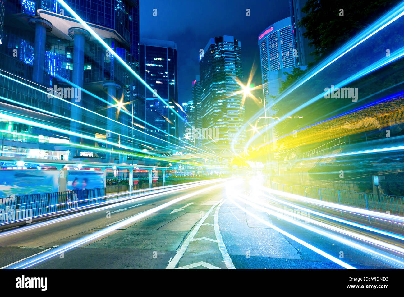 Traffic in between the city at night Stock Photo - Alamy