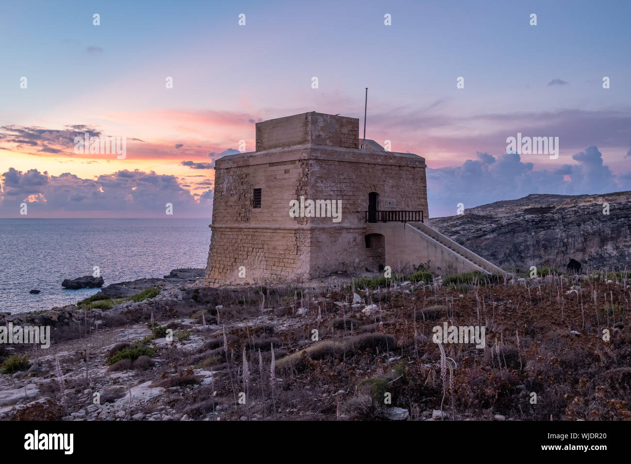 Sunset at Dwejra Tower (Qawra Tower), Gozo, Malta Stock Photo - Alamy