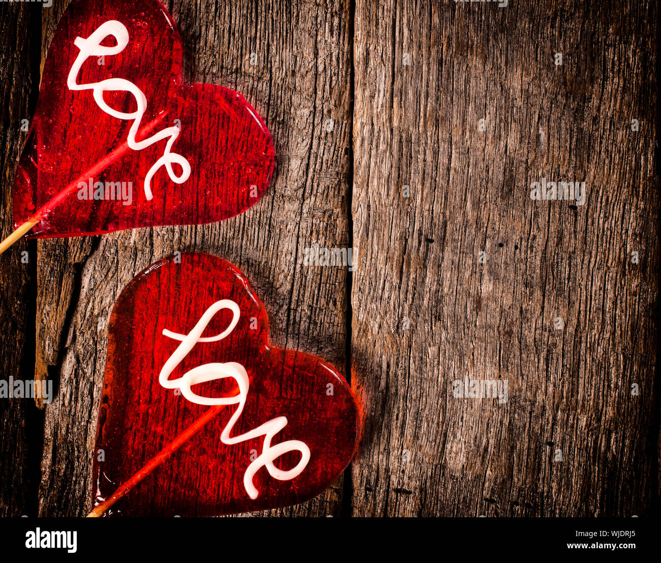 Two heart shape lolly pops on the wooden space with empty space Stock ...