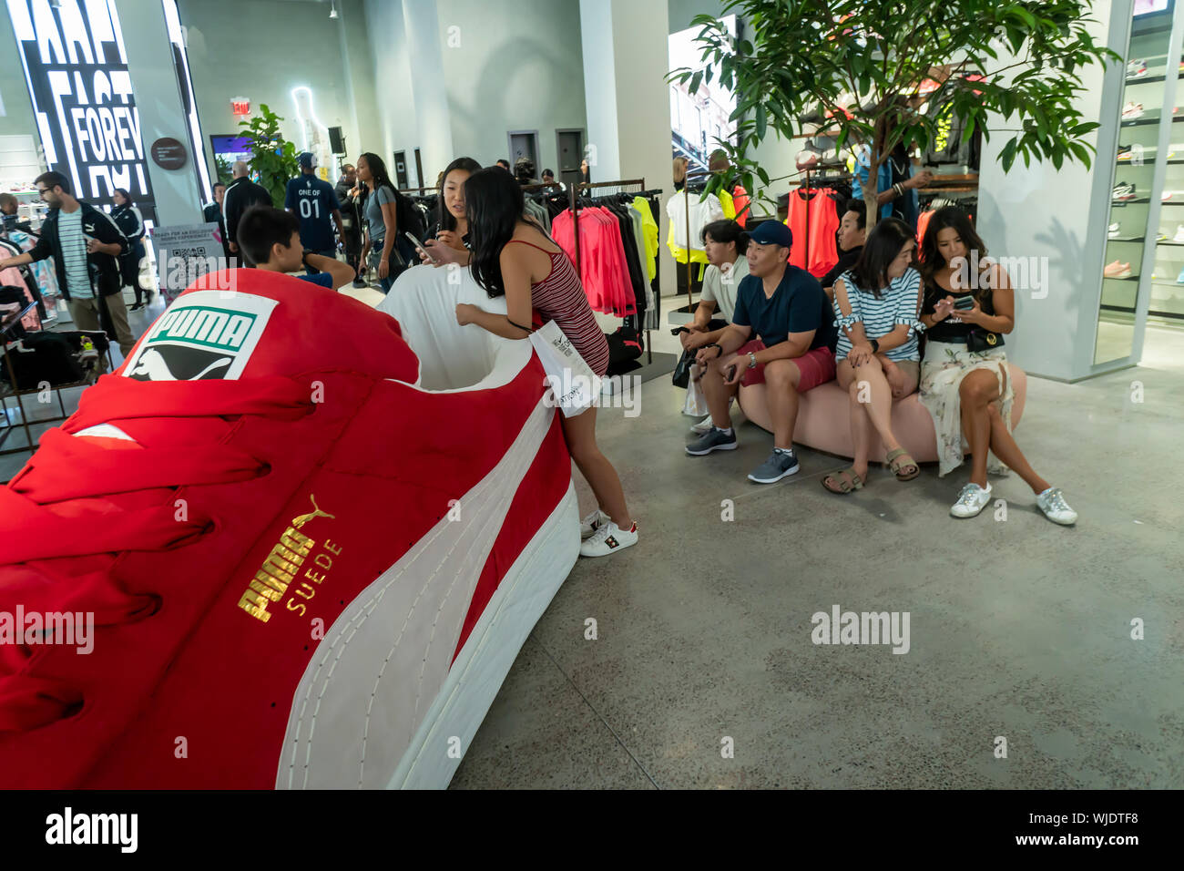 Shoppers and visitors flock to the newly opened Puma flagship store on ...