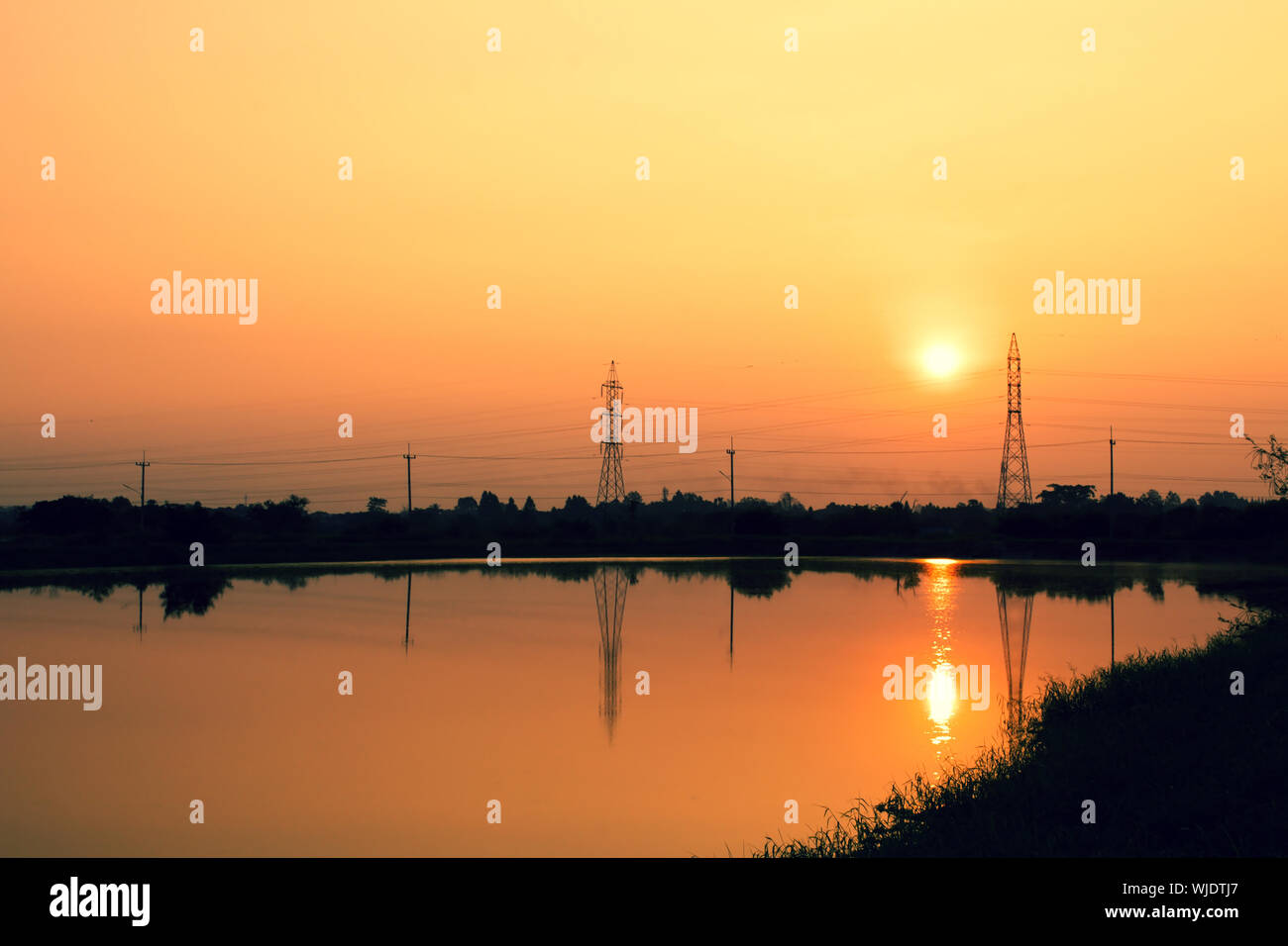 telephone poles on sunset at the river Stock Photo - Alamy