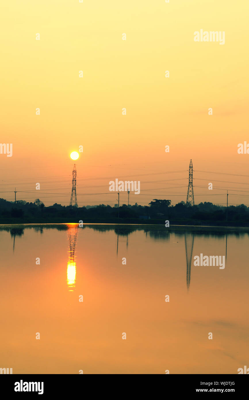 telephone poles on sunset at the river Stock Photo - Alamy
