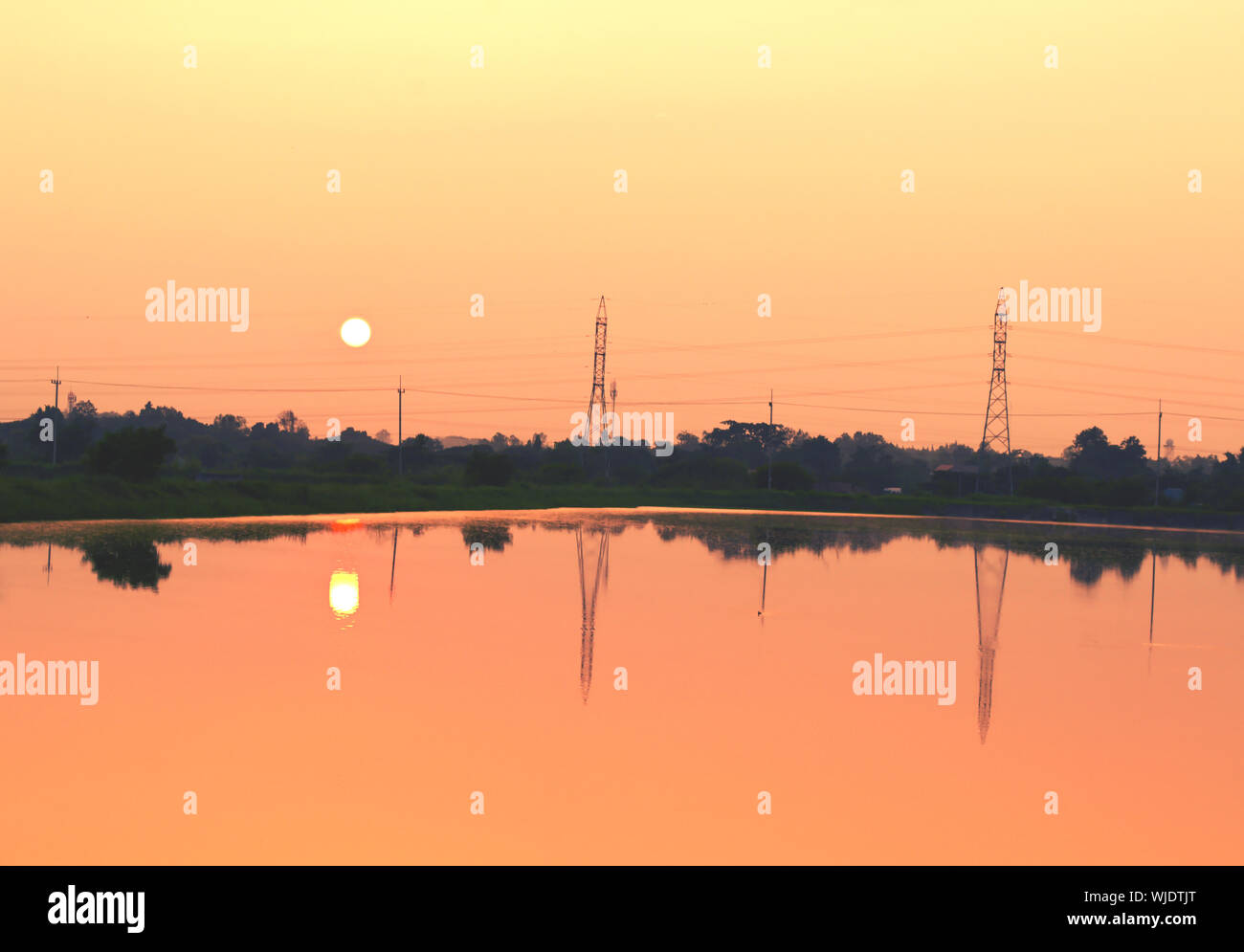 telephone poles on sunset at the river Stock Photo - Alamy