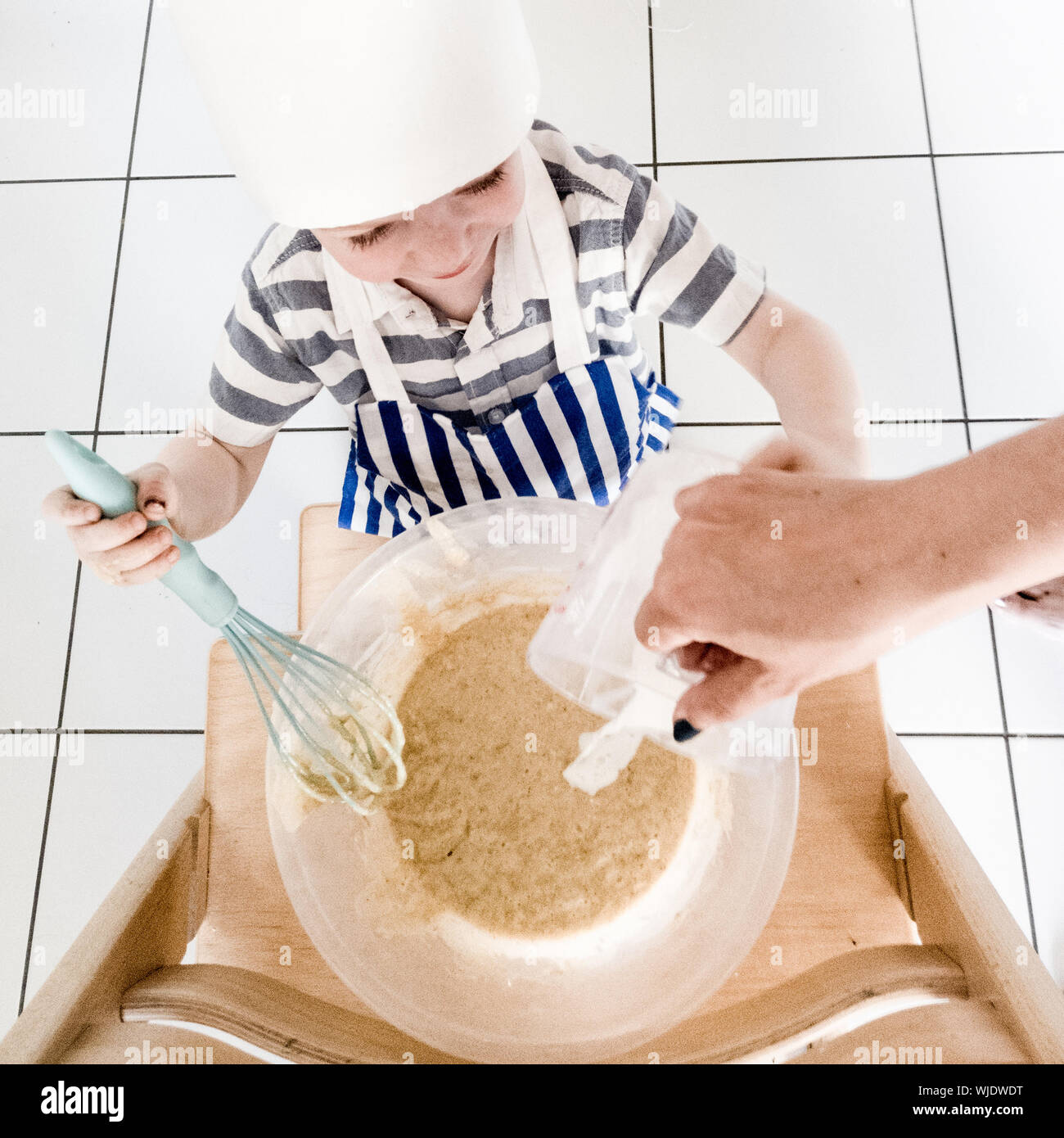 Woman mixing batter hi-res stock photography and images - Alamy