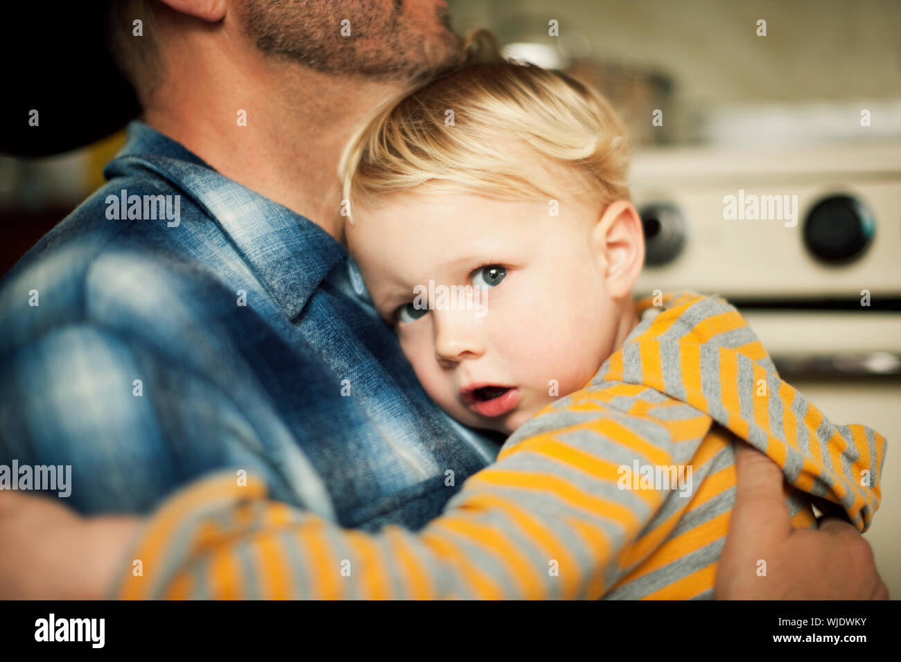Little boy hugging his Father Stock Photo - Alamy