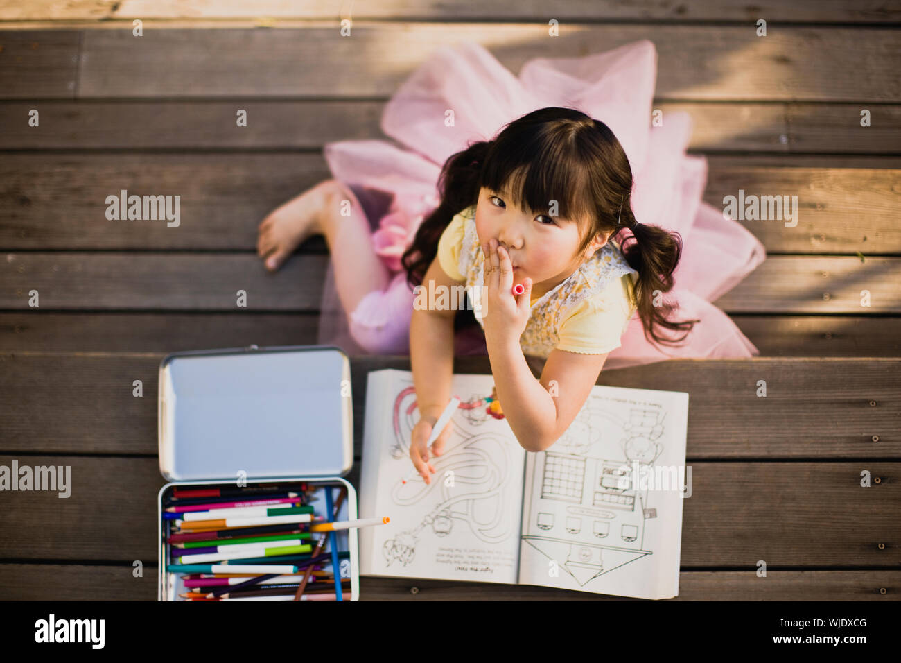 Young girl coloring Stock Photo - Alamy