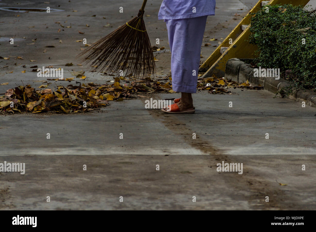 Man sweeping road hi-res stock photography and images - Alamy
