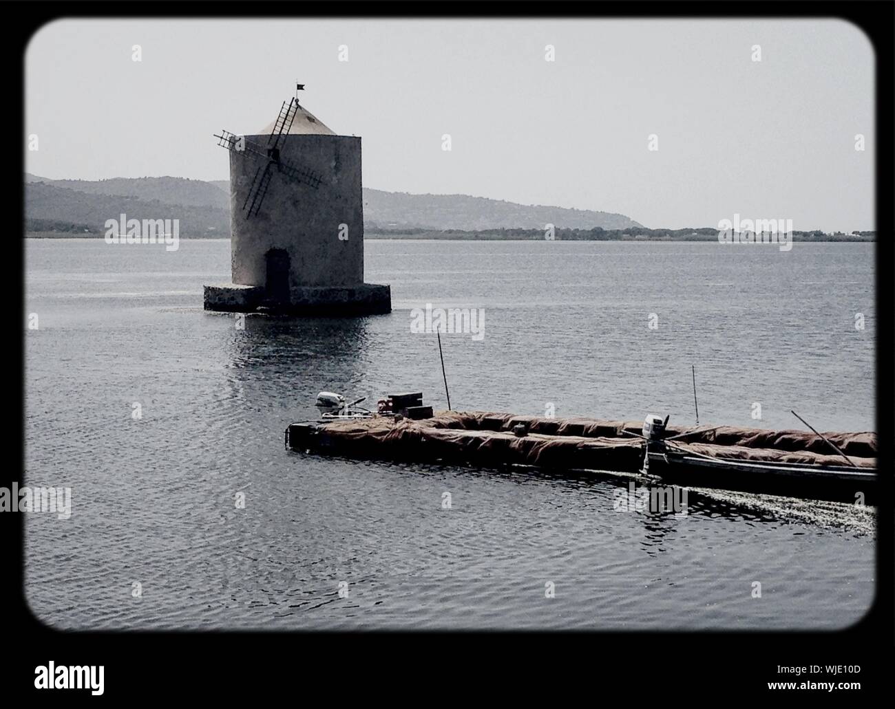 Traditional Windmill In Lake Stock Photo - Alamy