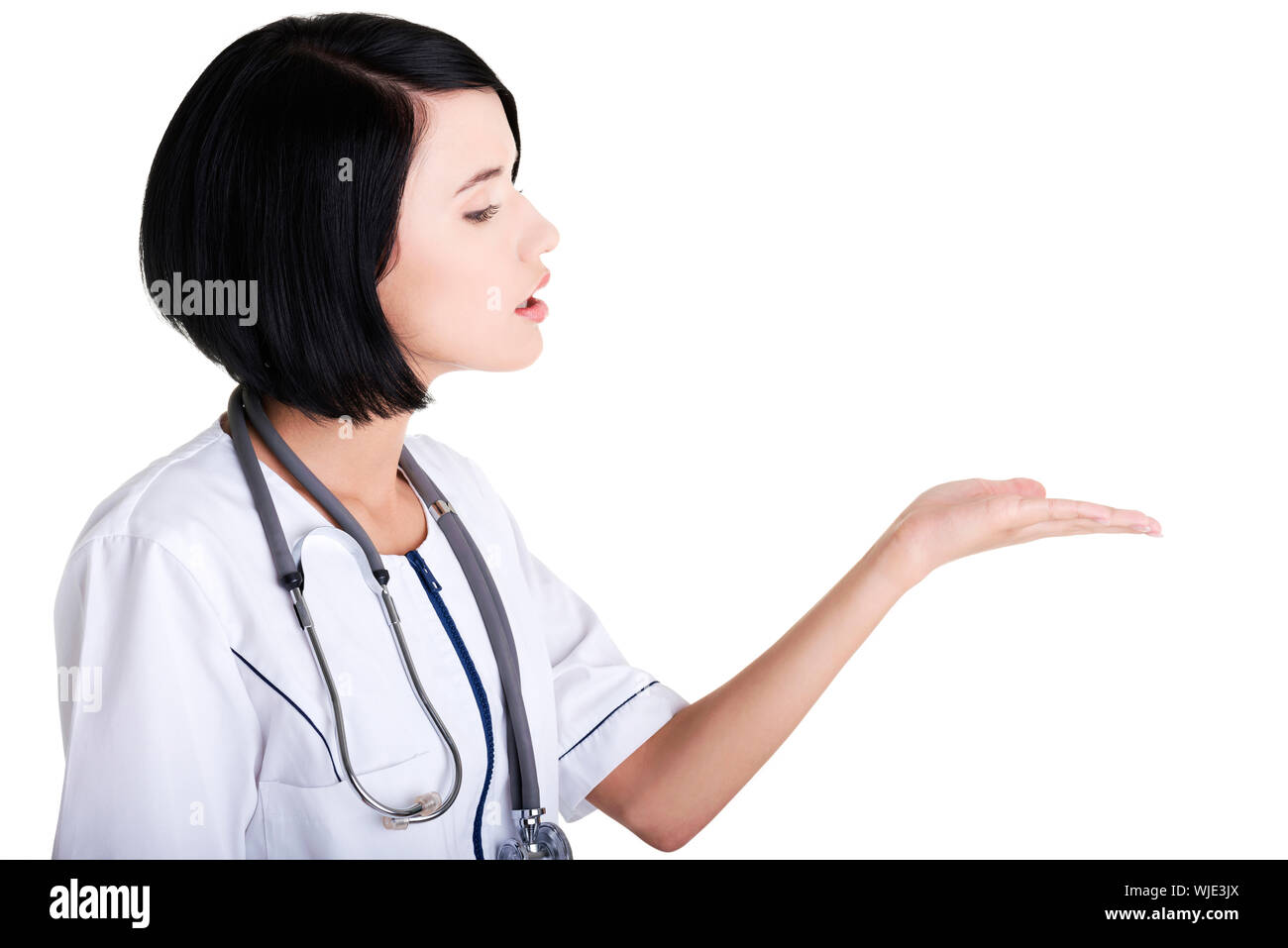 Medical doctor woman or nurse presenting and showing copy space for ...