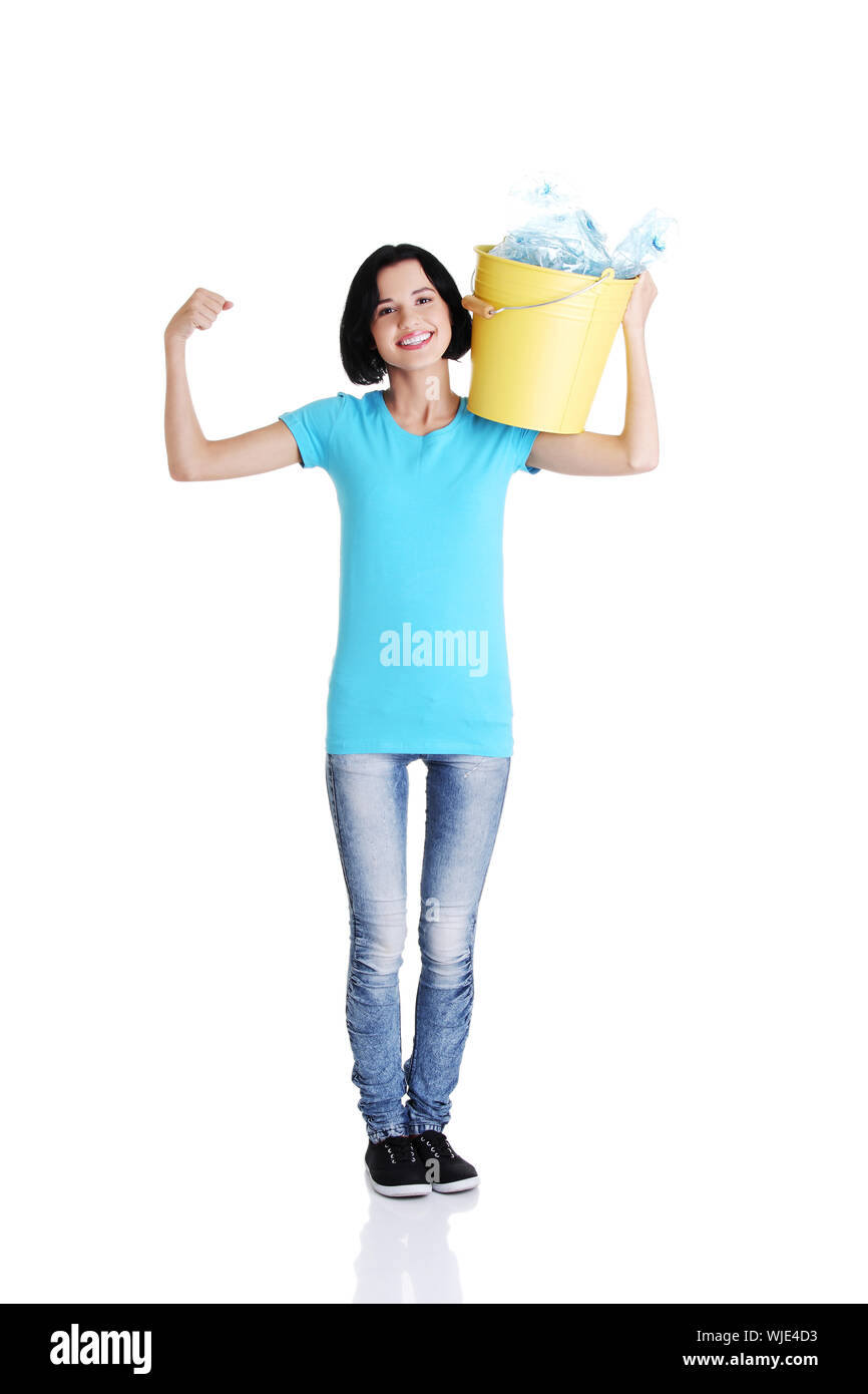 Beautiful young woman holding recycling bin isolated on white ...