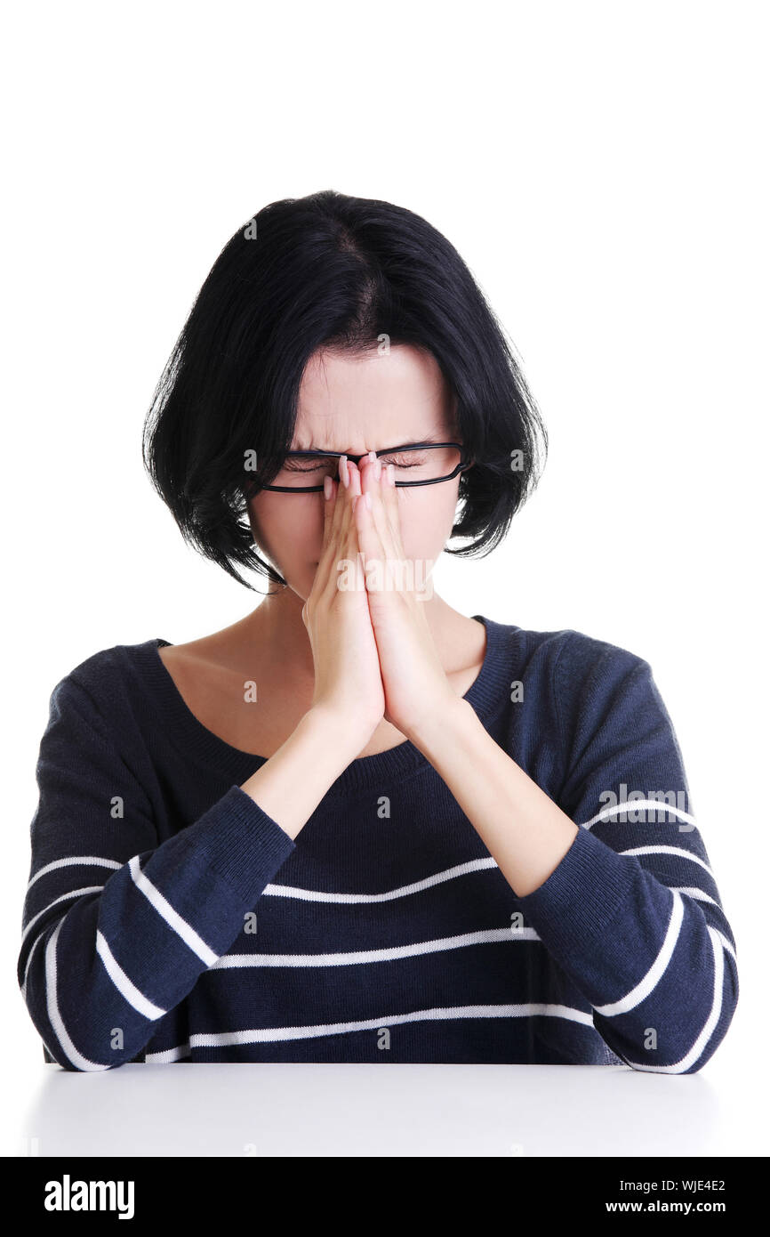 Young sad woman, have big problem or depression, over white background ...