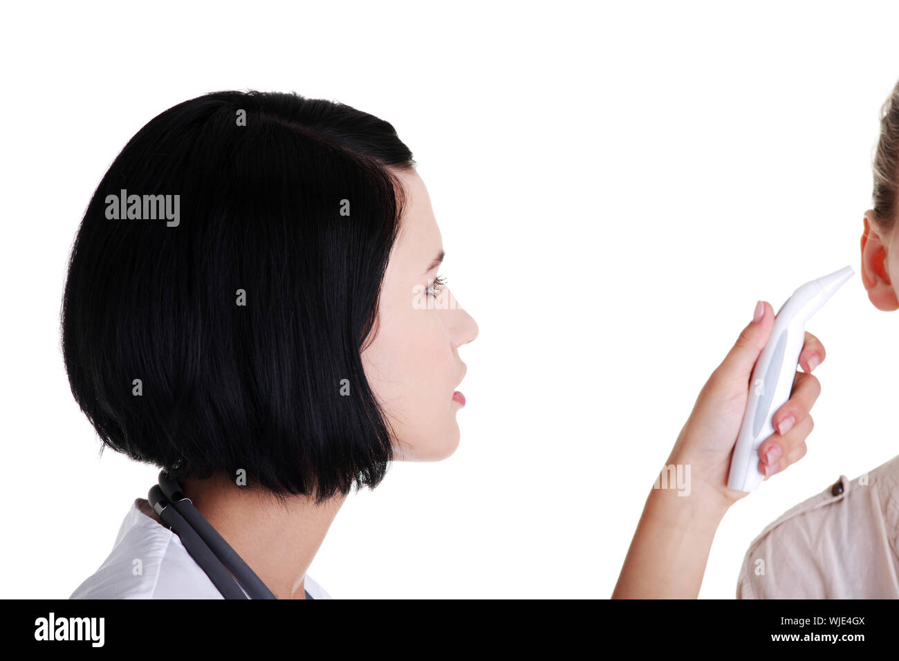 Female doctor or nurse checking temperature of her patient Stock Photo ...
