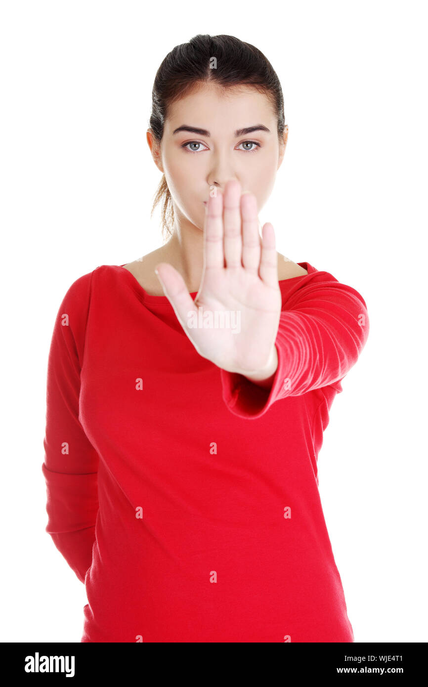 Hold on, Stop gesture showed by young woman hand Stock Photo - Alamy