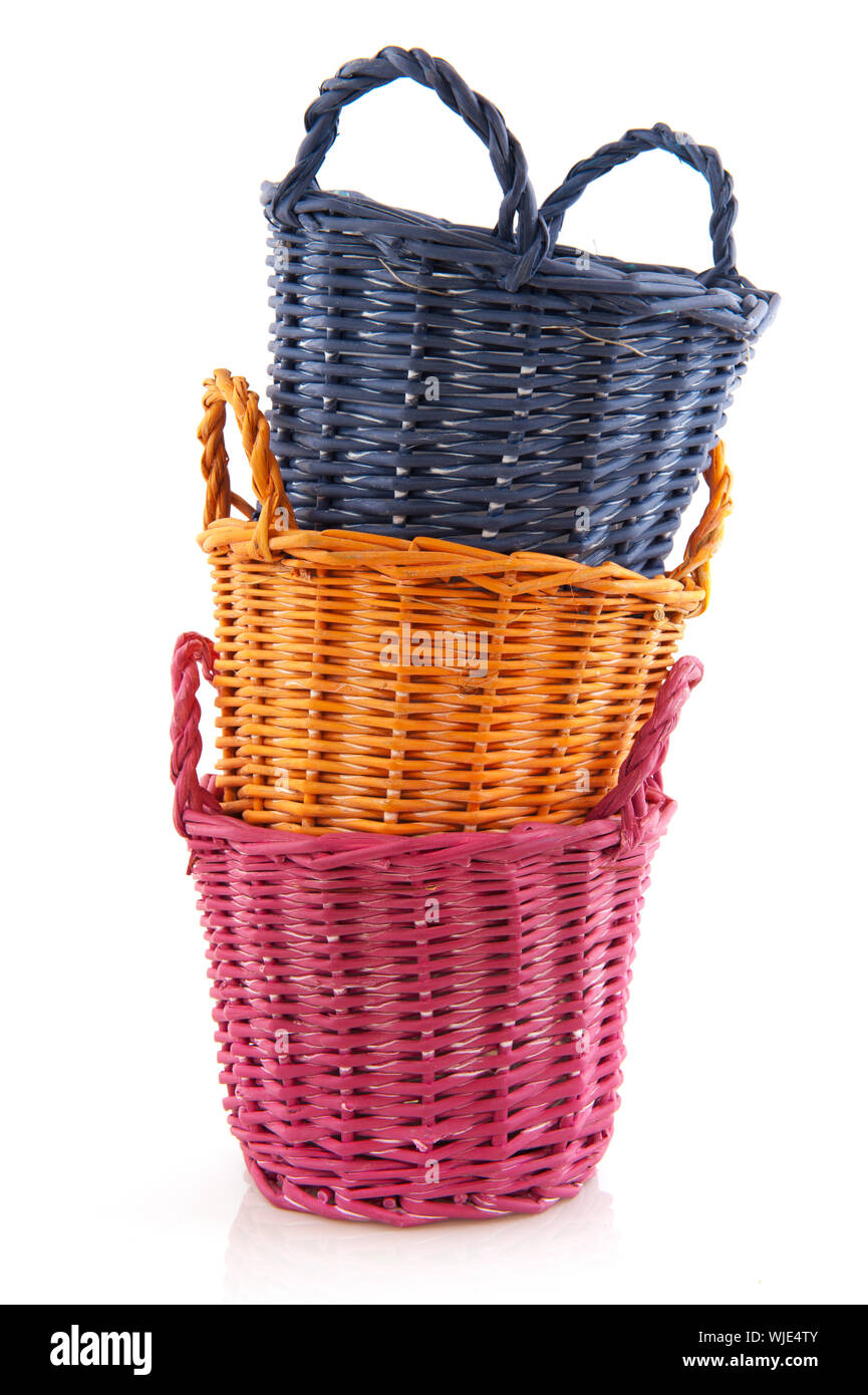 colorful wicked empty cane baskets isolated over white Stock Photo - Alamy