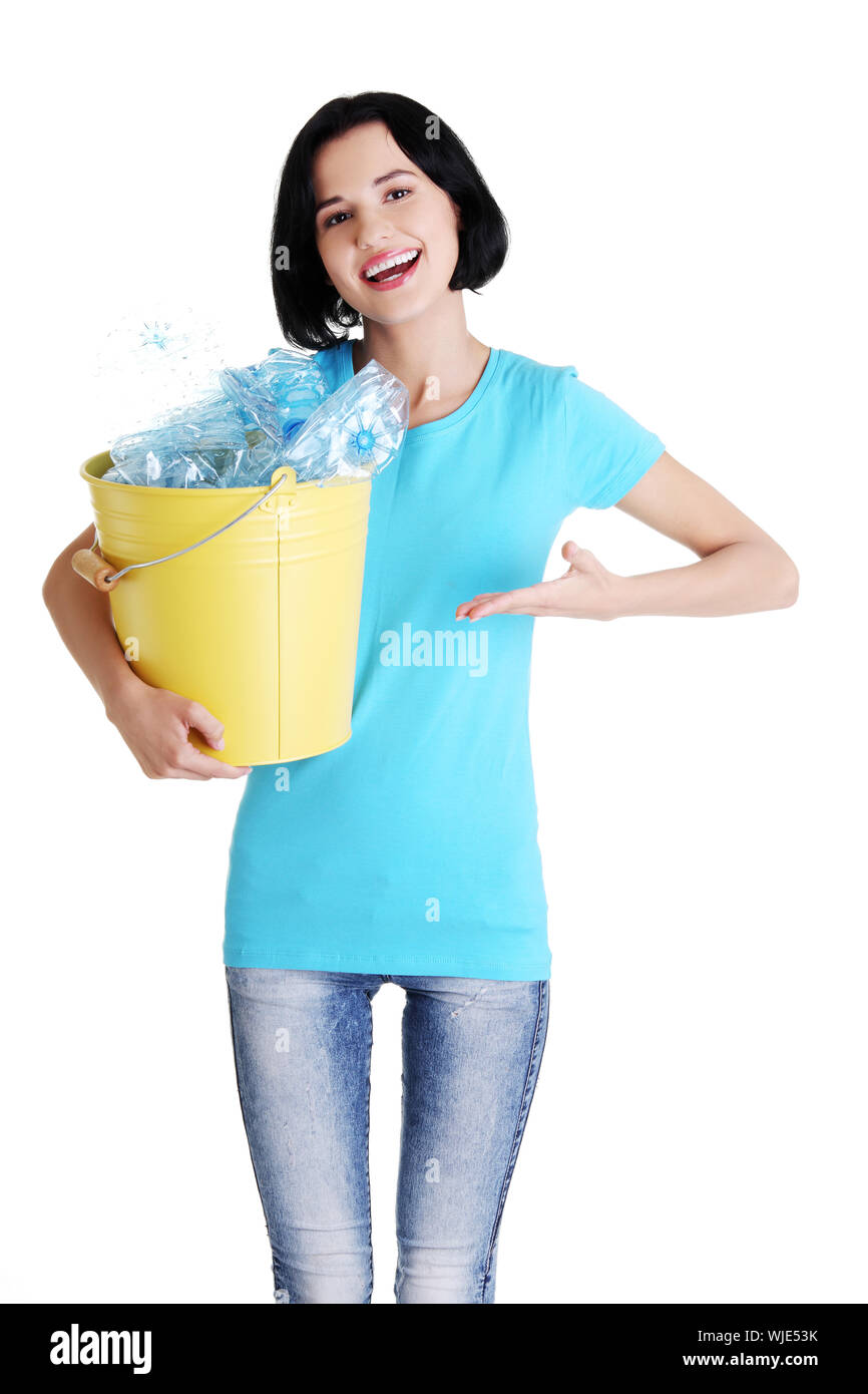 Beautiful young woman holding recycling bin isolated on white ...