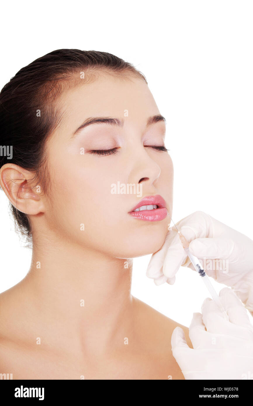 Cosmetic botox injection in the female face, lips zone Stock Photo - Alamy