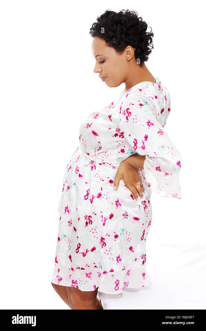 Pregnant woman heaving back pain, isolated on white background Stock ...