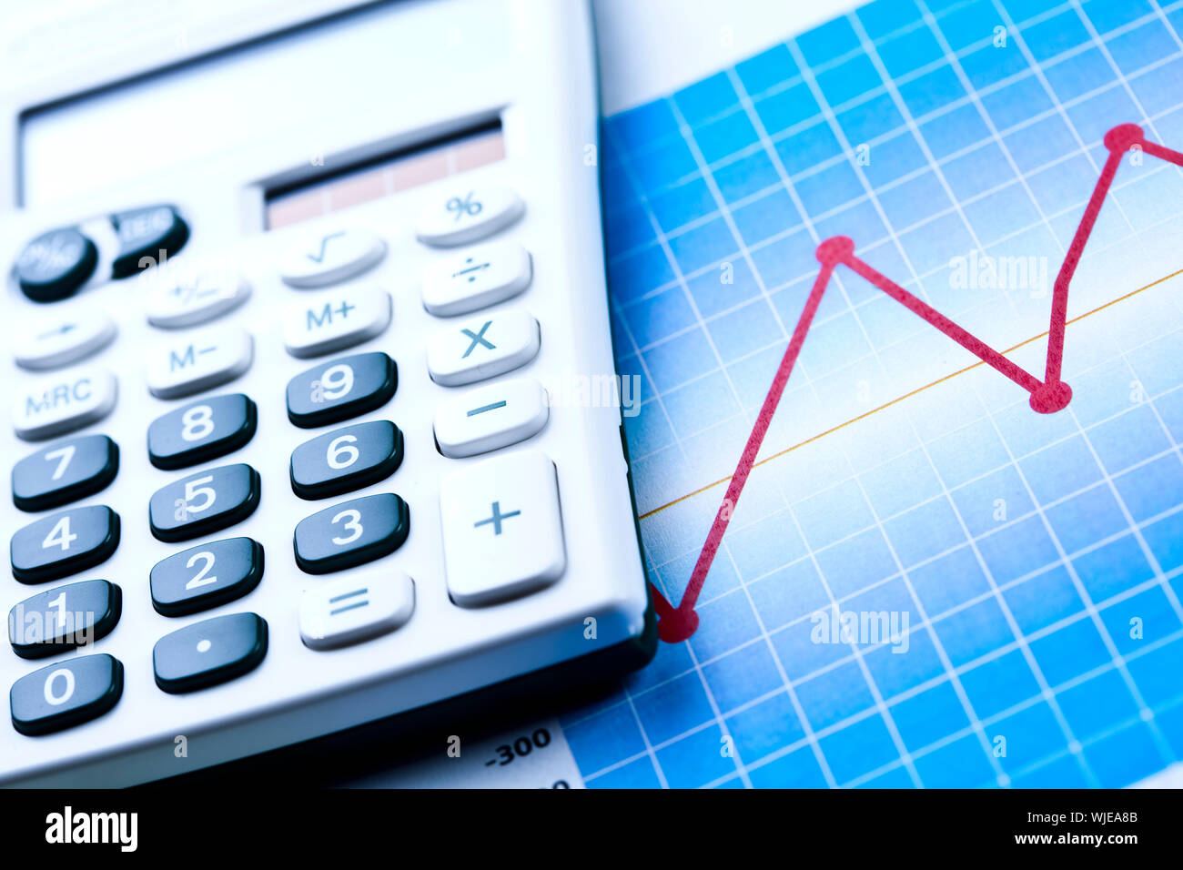 Diagram and calculator Stock Photo - Alamy
