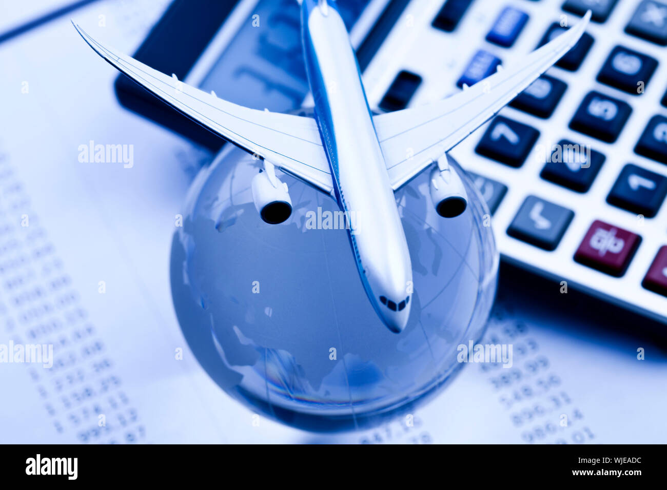 Airplane in finance and world Stock Photo - Alamy