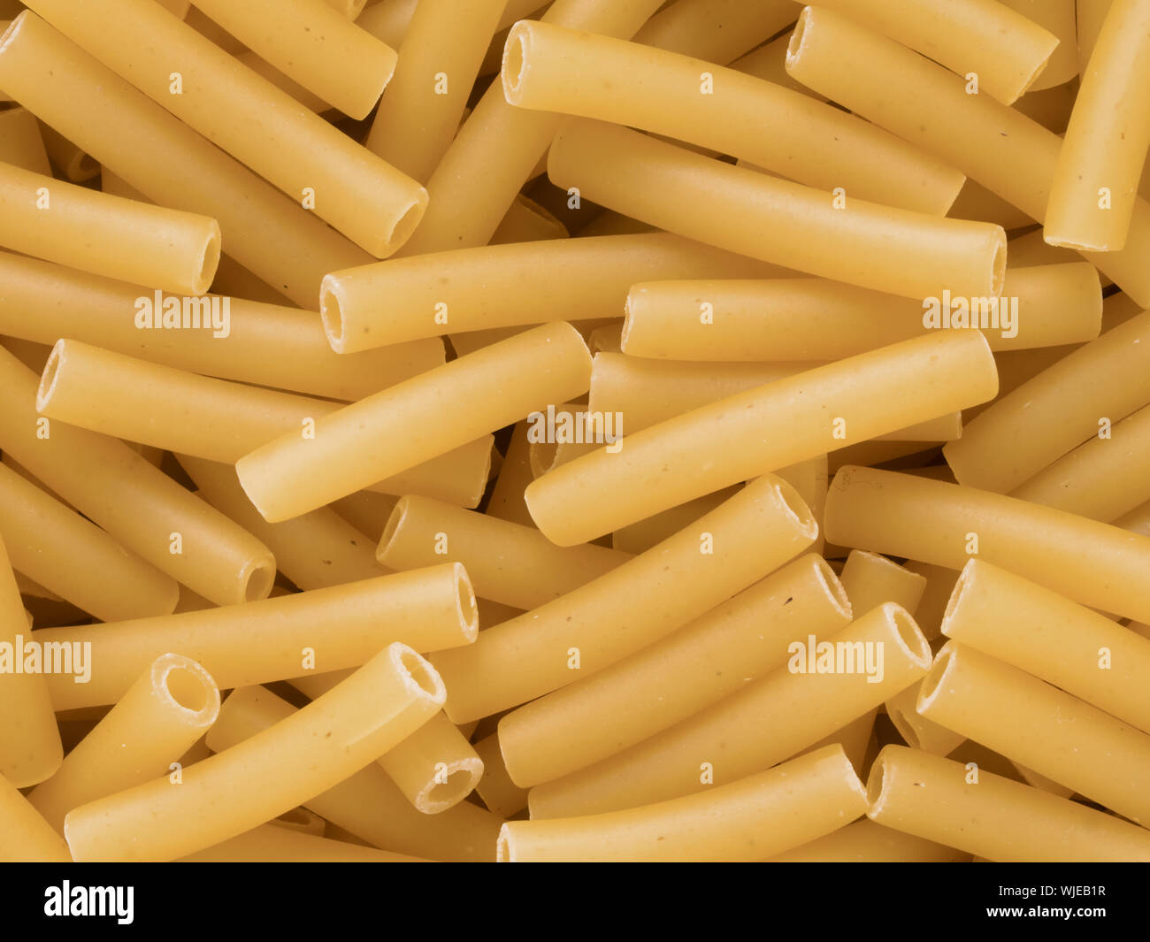 close up of macaroni pasta tubes food background Stock Photo - Alamy