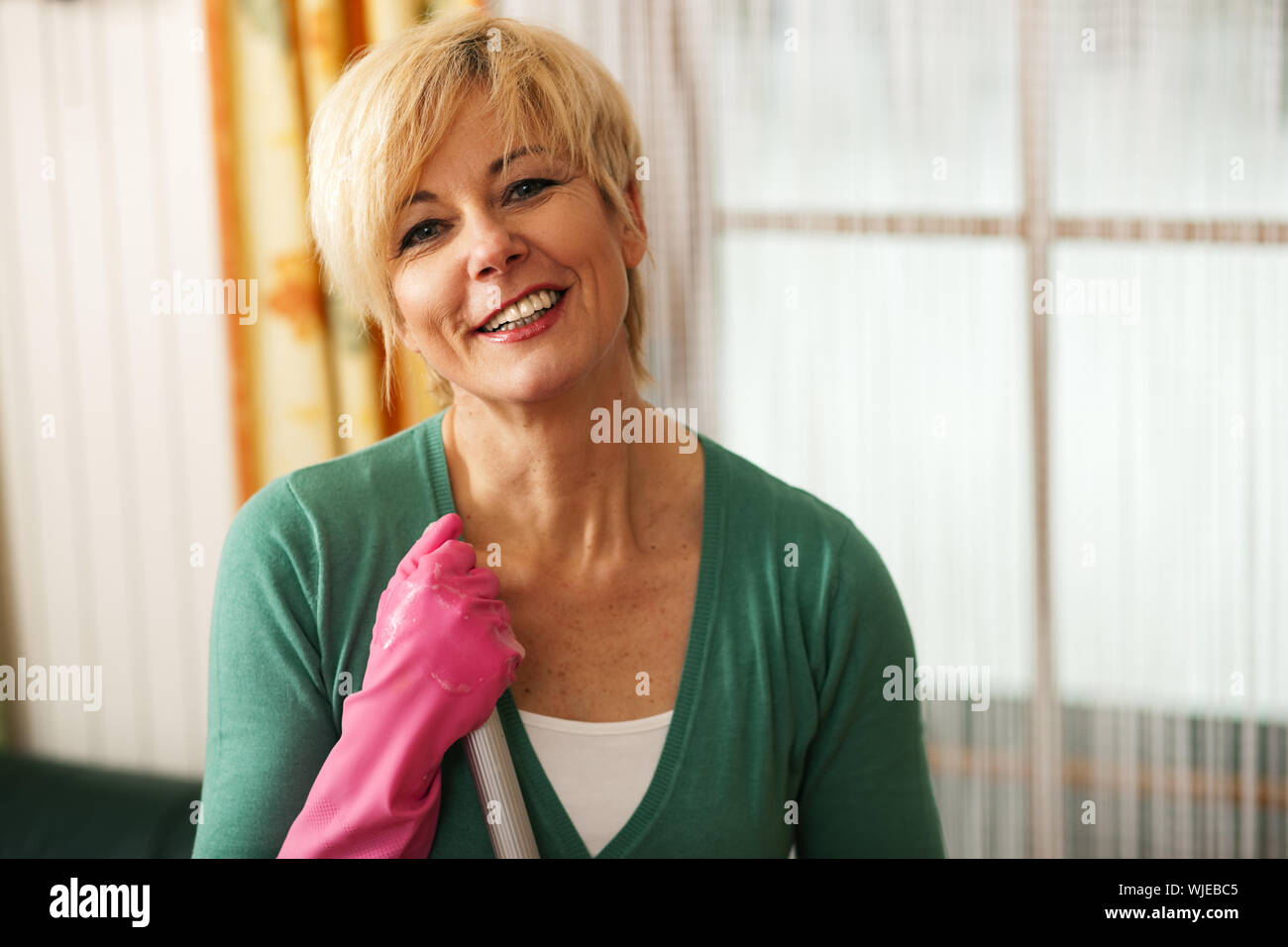 Woman mopping the floor in her home Stock Photo - Alamy