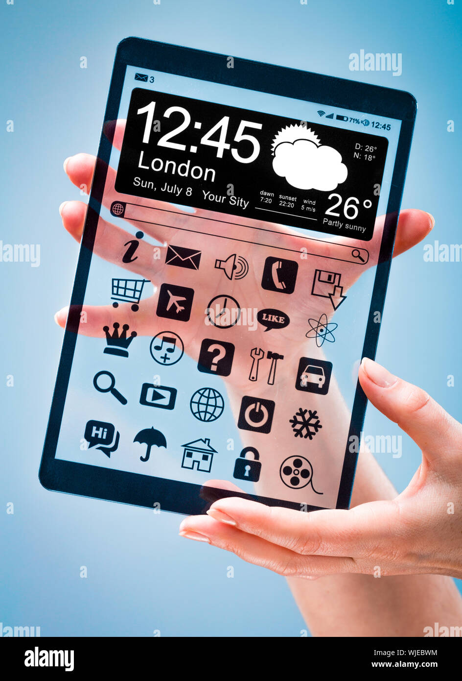 Tablet with a transparent display in human hands on a blue background ...