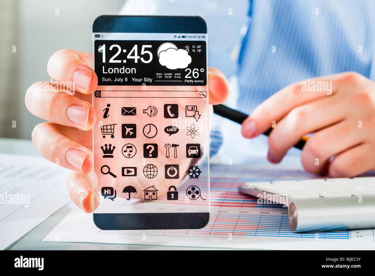 Smartphone (phablet) with a transparent display in human hands. Concept ...