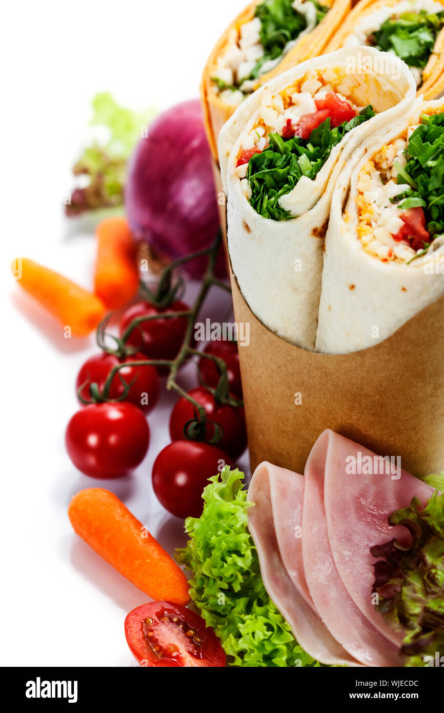 tortilla wraps with chicken and fresh vegetables isolated on white ...