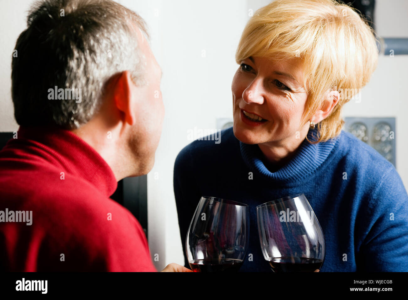 Couple red wine fireplace hi-res stock photography and images - Alamy