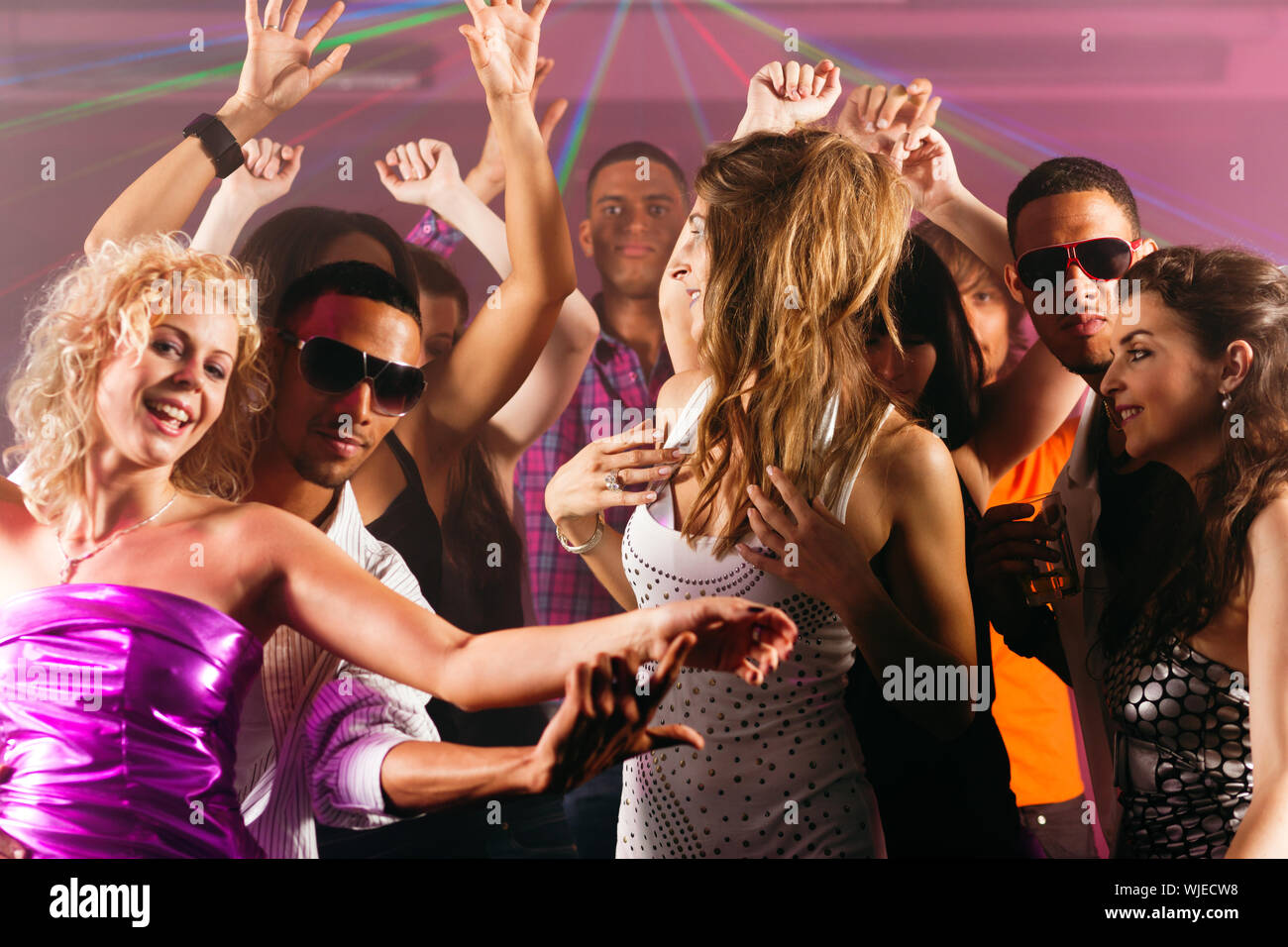 Group of friends in nightclub Stock Photo - Alamy