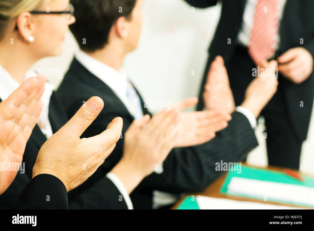 Business presentation: applause Stock Photo - Alamy