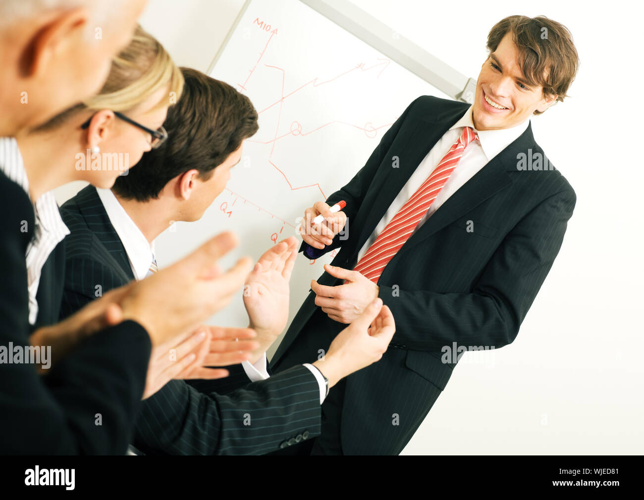 Business presentation: applause Stock Photo - Alamy