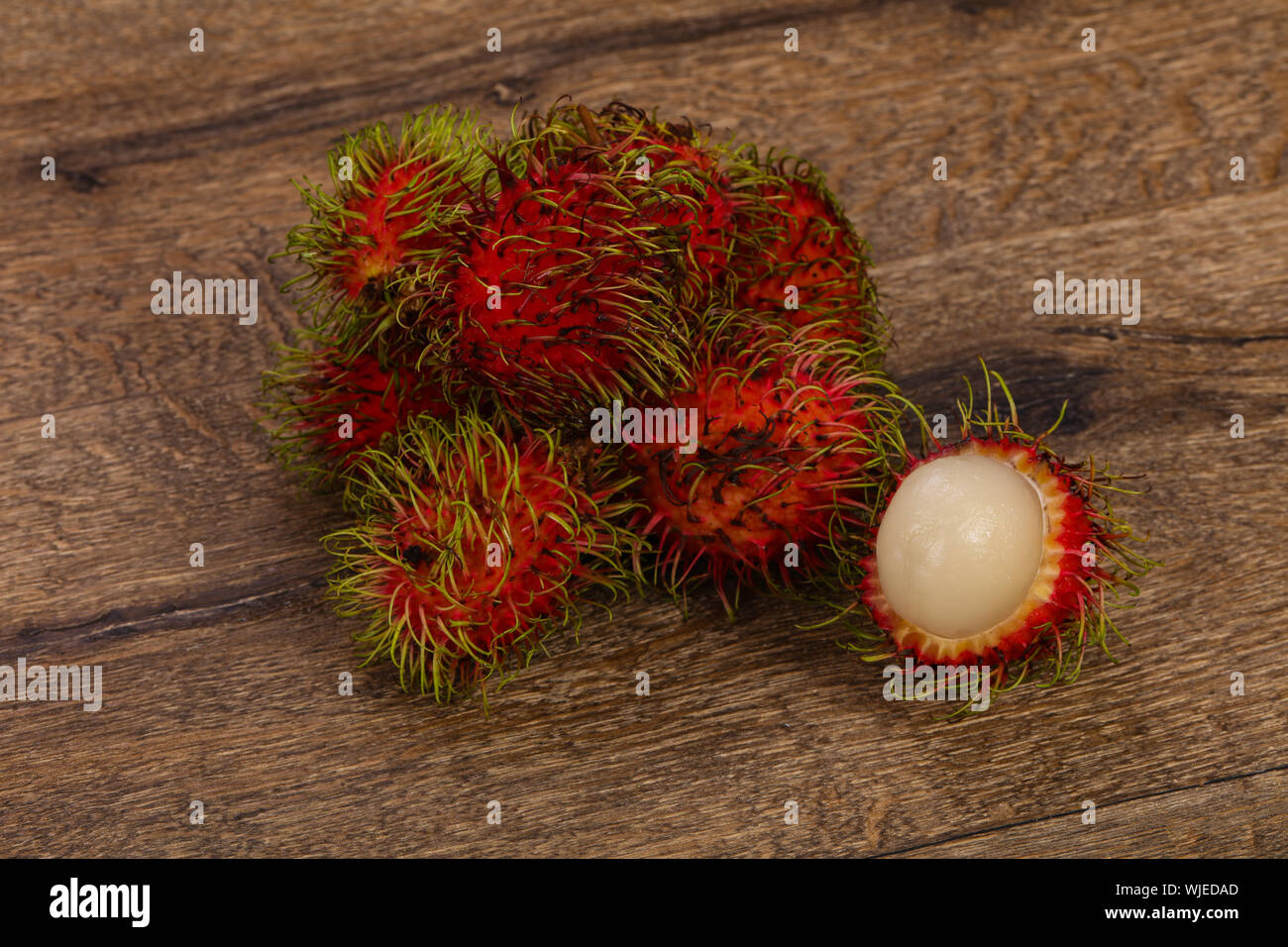Tropical sweet exotic fruit Rambutan heap Stock Photo - Alamy